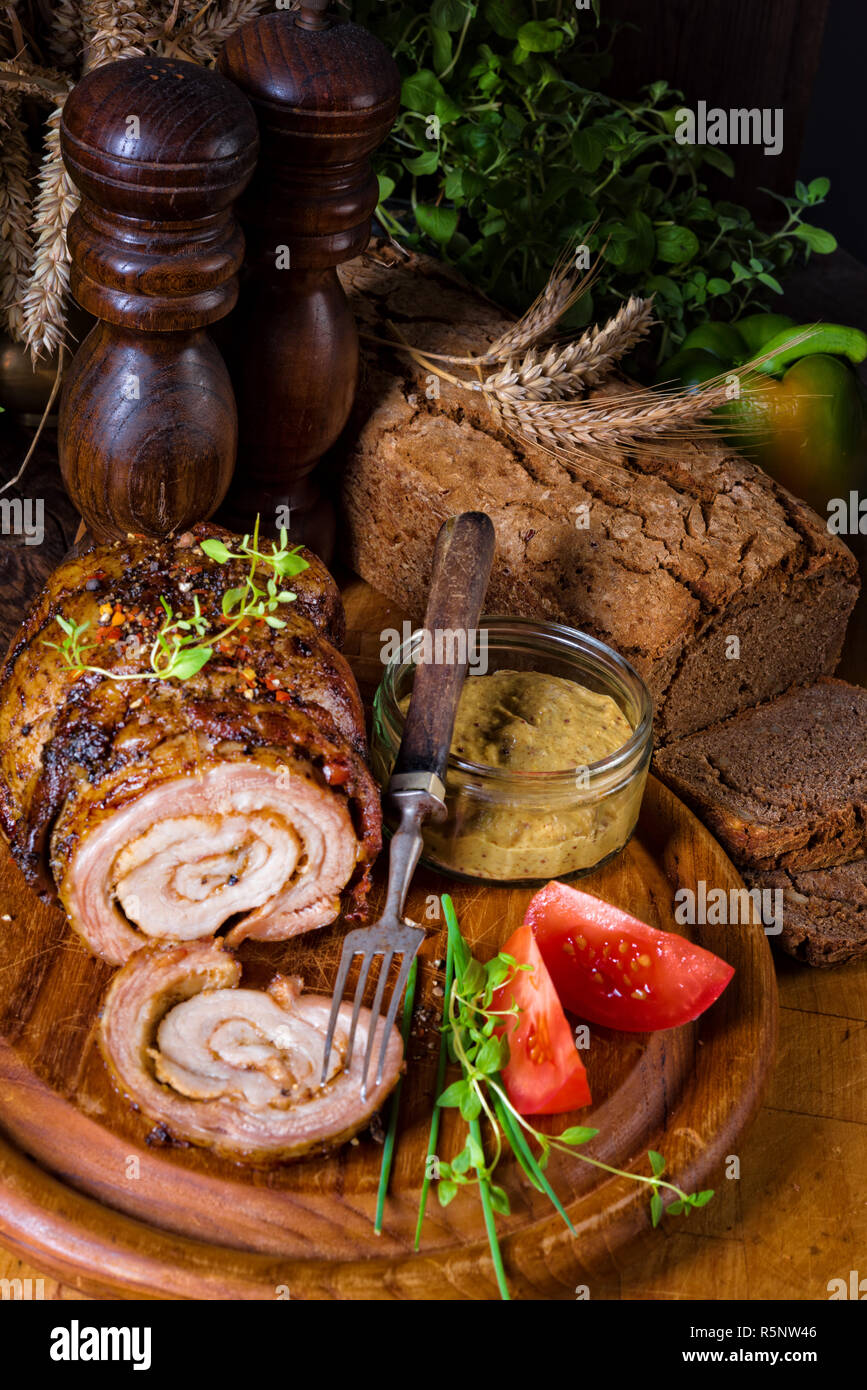 rolling roast fullly with dried fruit and bacon Stock Photo - Alamy