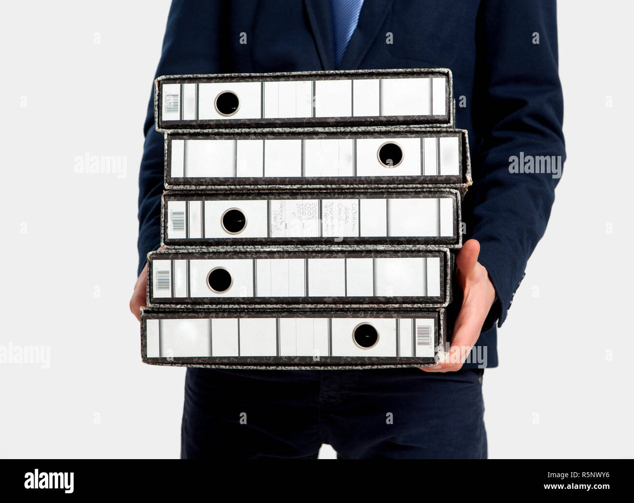 Business man carrying folders Stock Photo - Alamy