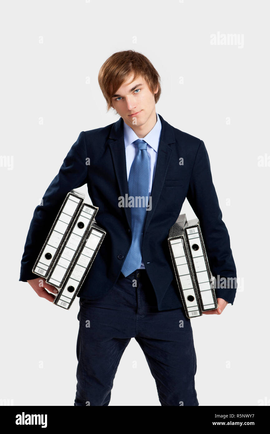 Business man carrying folders Stock Photo - Alamy