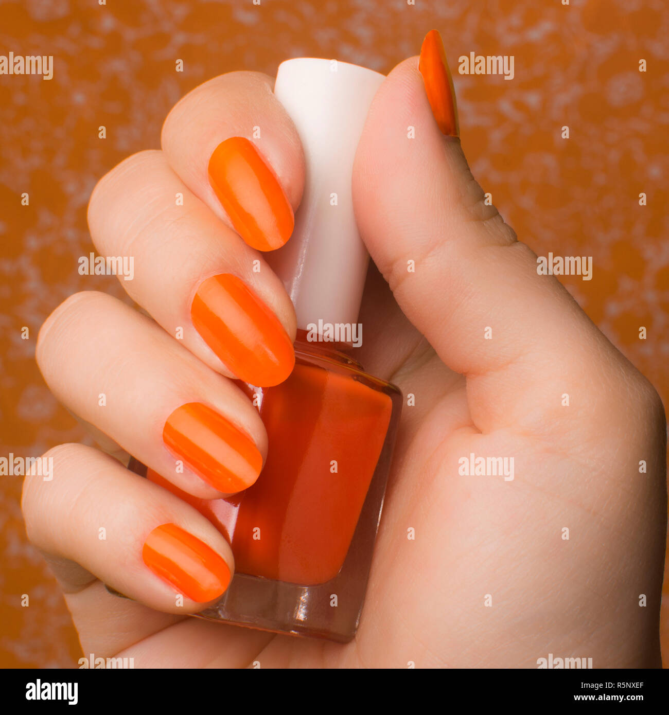 orange nail polish Stock Photo - Alamy