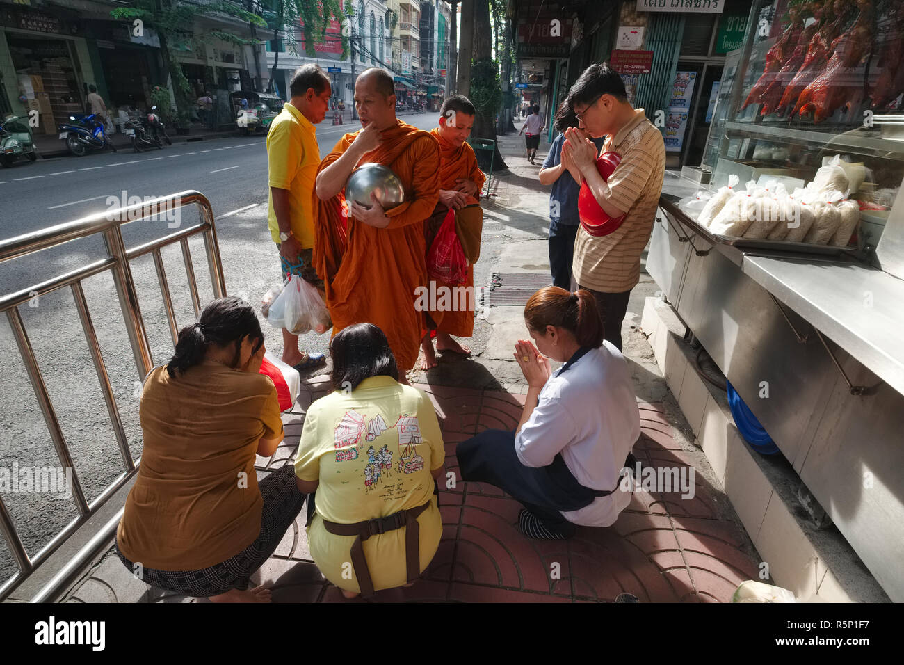 Buddhist monks on their alms round in Chinatown, Bangkok, Thailand ...
