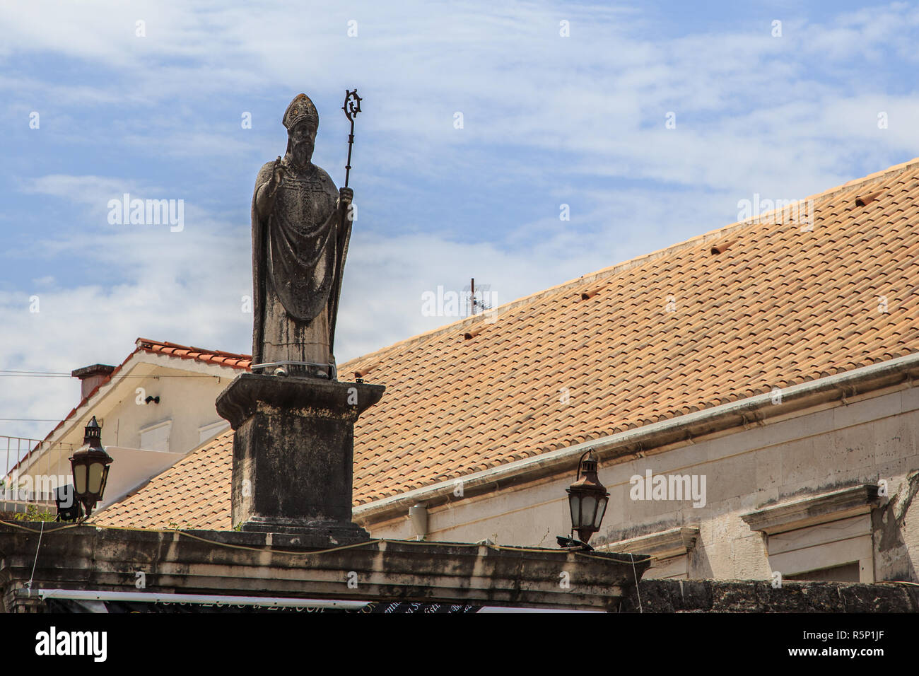 Statue of St. John on the North Town Gate of old town Trogir, Croatia ...