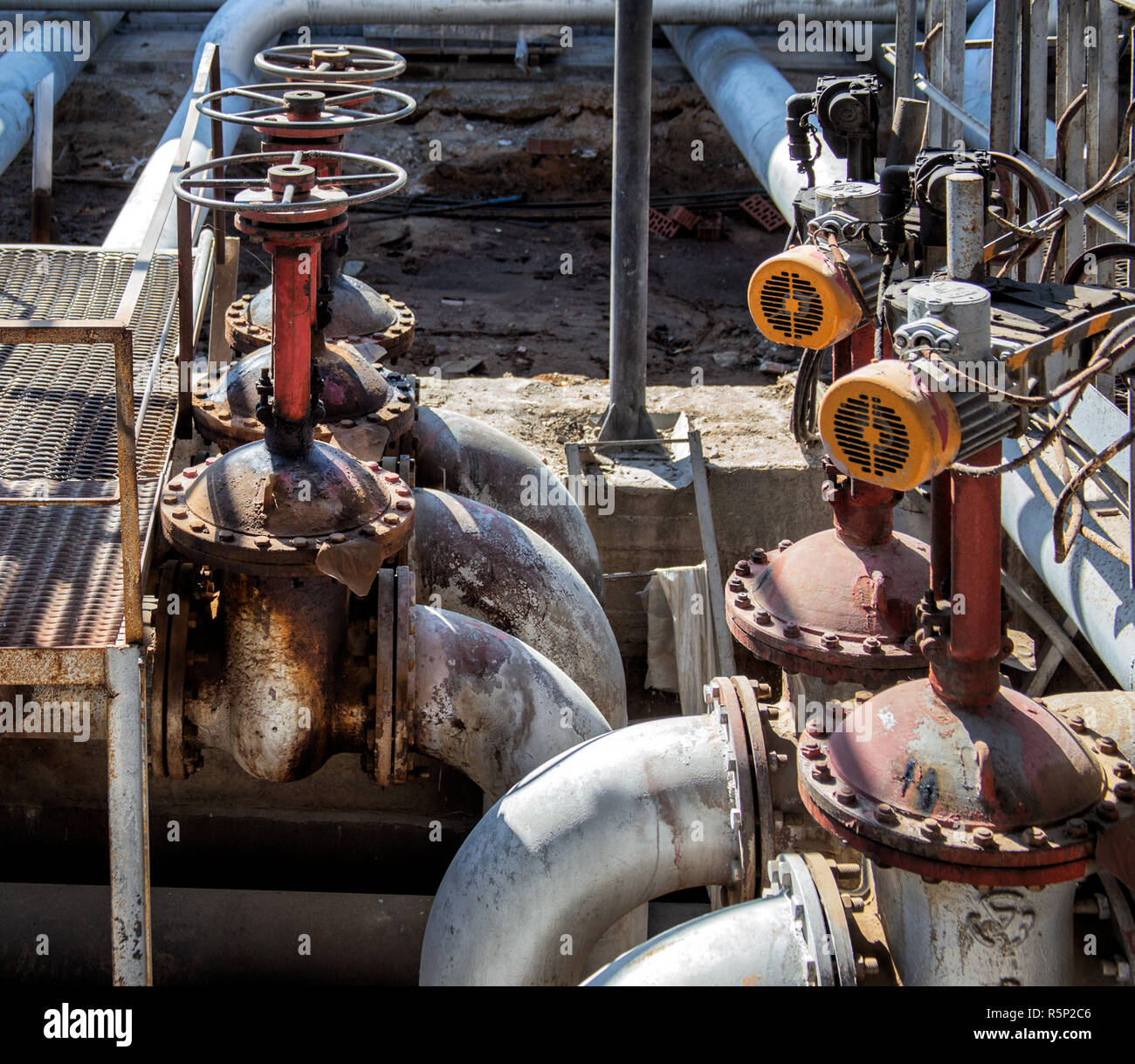 old Oil and gas pipe line and valves Stock Photo - Alamy