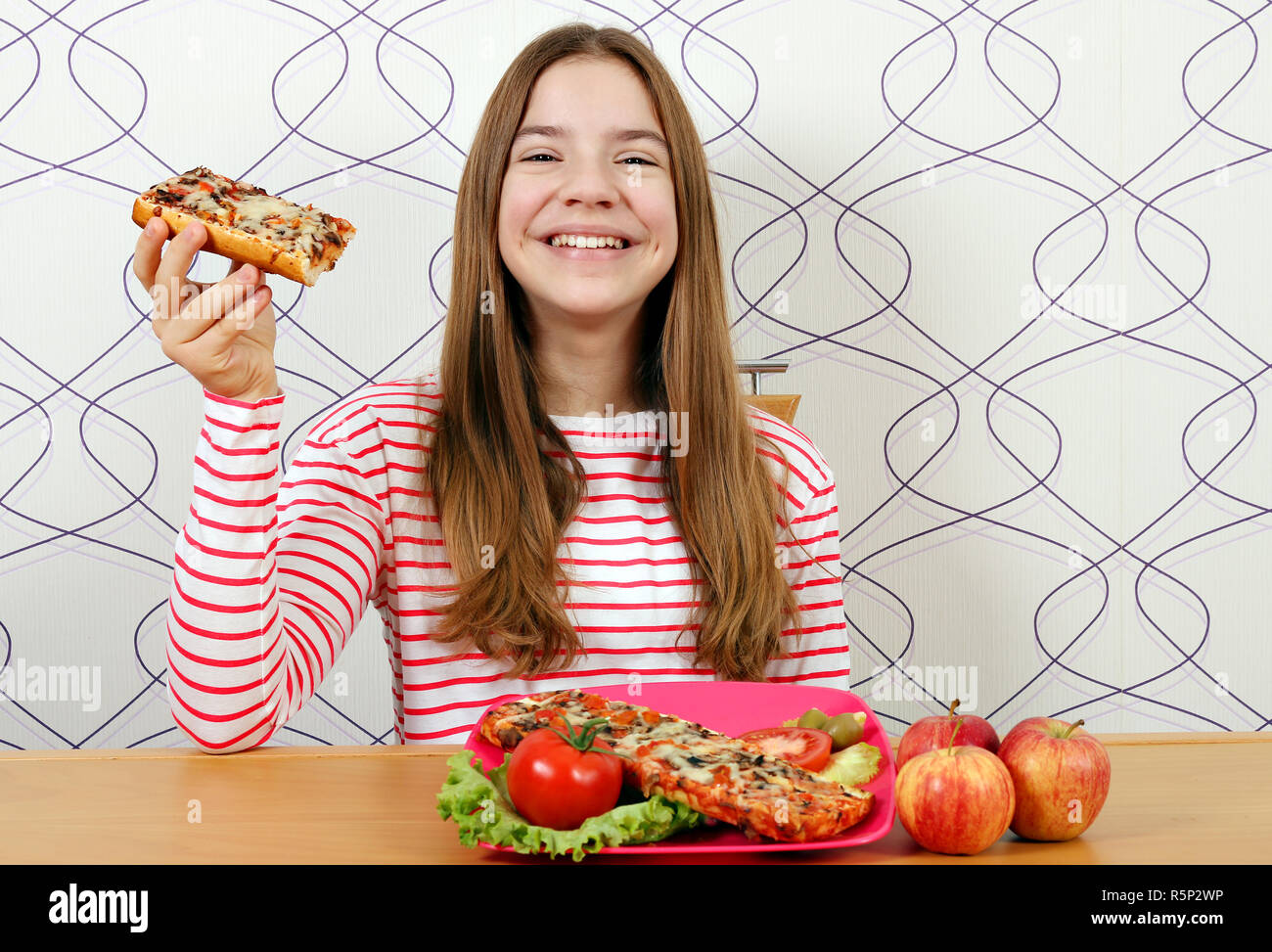 Happy beautiful teenage girl with sandwich Stock Photo - Alamy