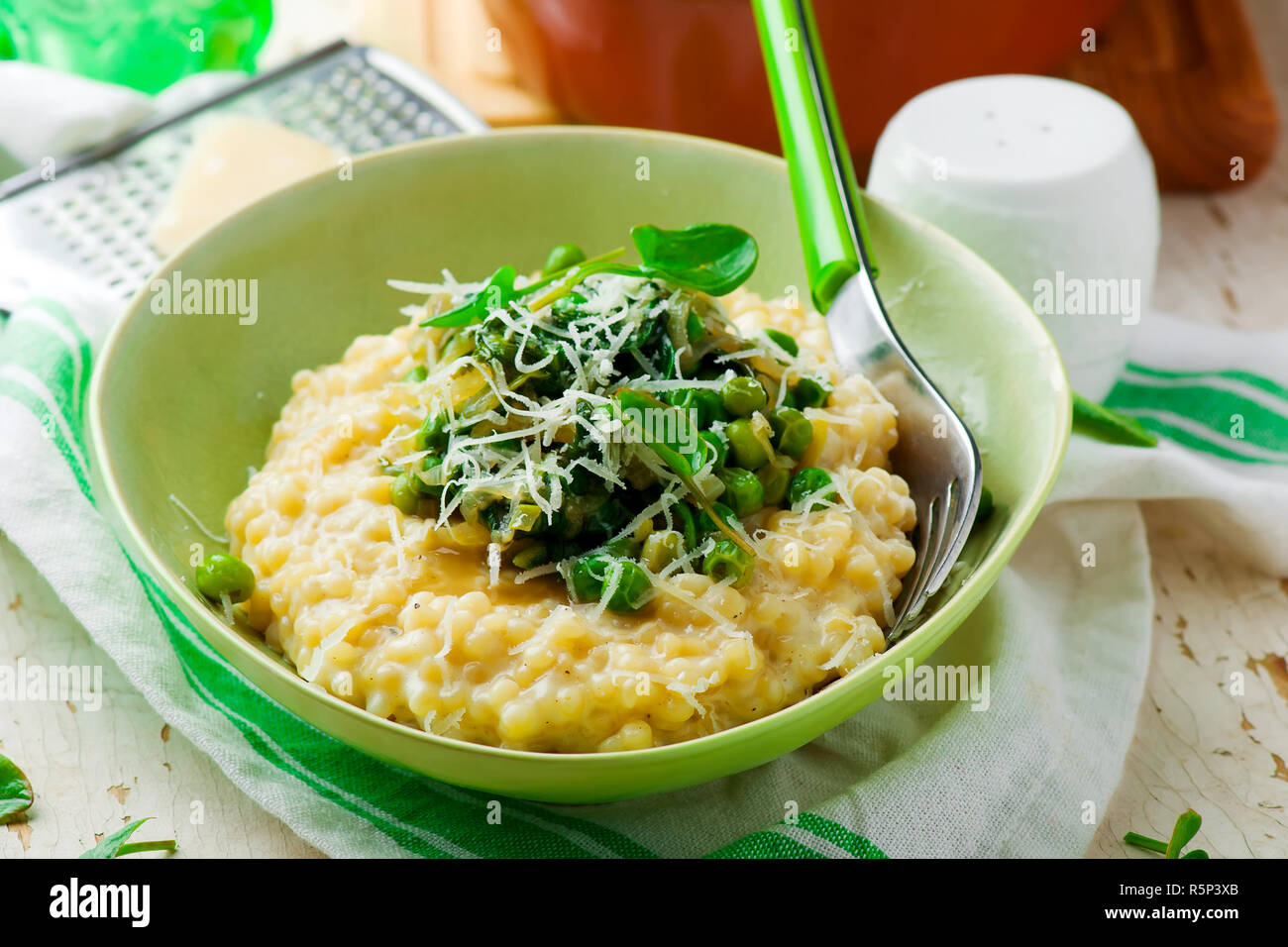 Pasta risotto with spring vegetables.selective focus Stock Photo - Alamy