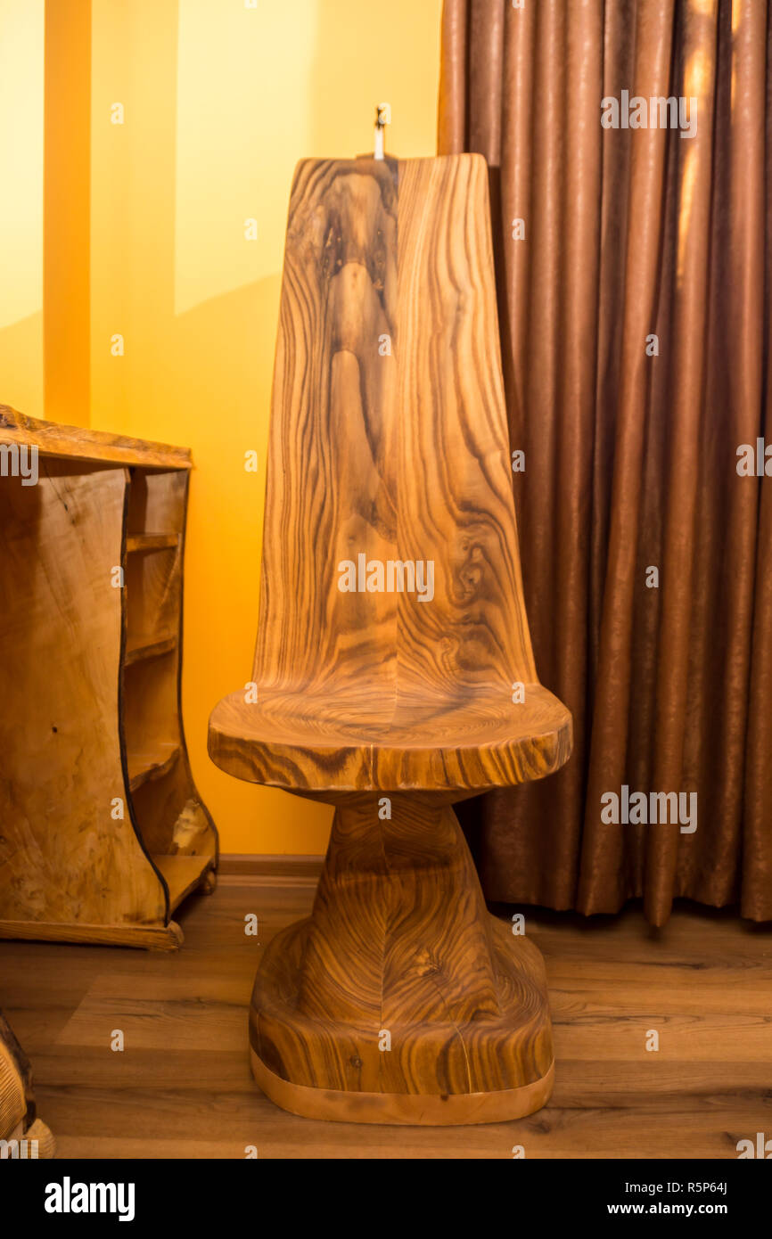 Unique high chair carved from one whole piece of wood Stock Photo - Alamy