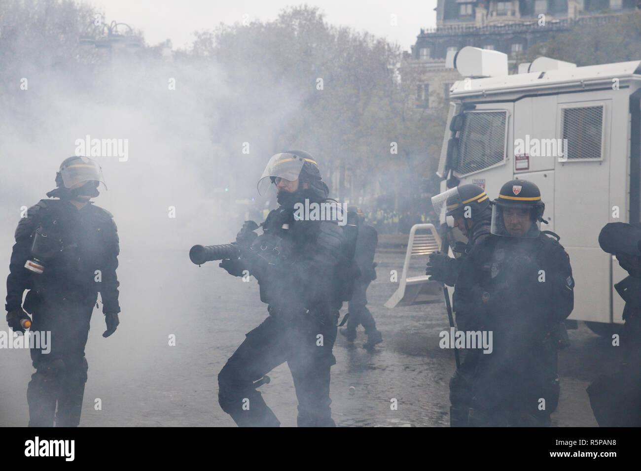 Paris, France. 1st December 2018. Riot Police uses a water canon and ...