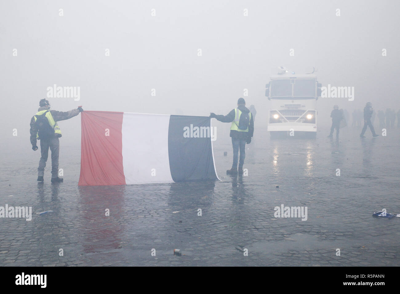 Paris, France. 1st December 2018. Riot Police uses a water canon and ...