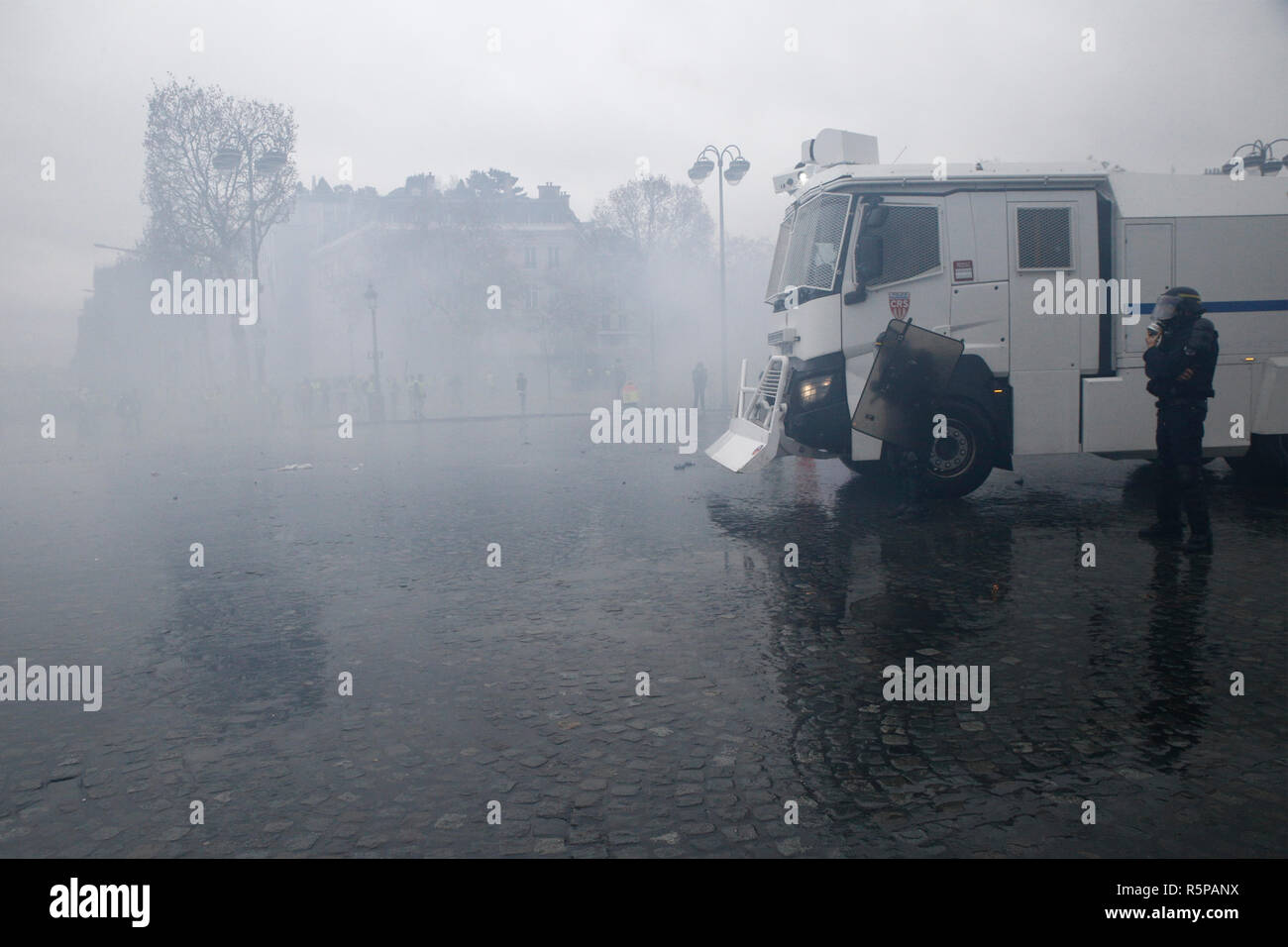 Paris, France. 1st December 2018. Riot Police uses a water canon and ...
