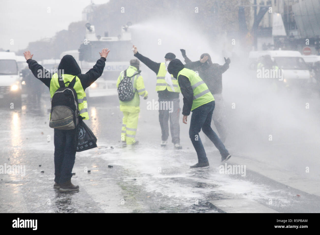 Paris, France. 1st December 2018. Riot Police uses a water canon and ...