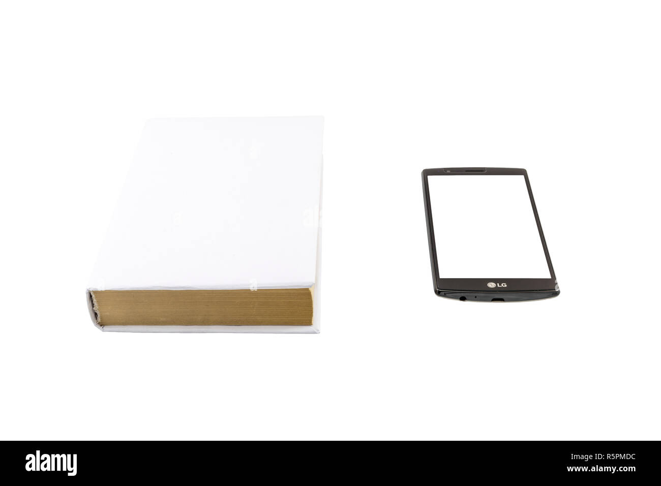 Smartphone and a book isolated on white. New versus old concept Stock ...