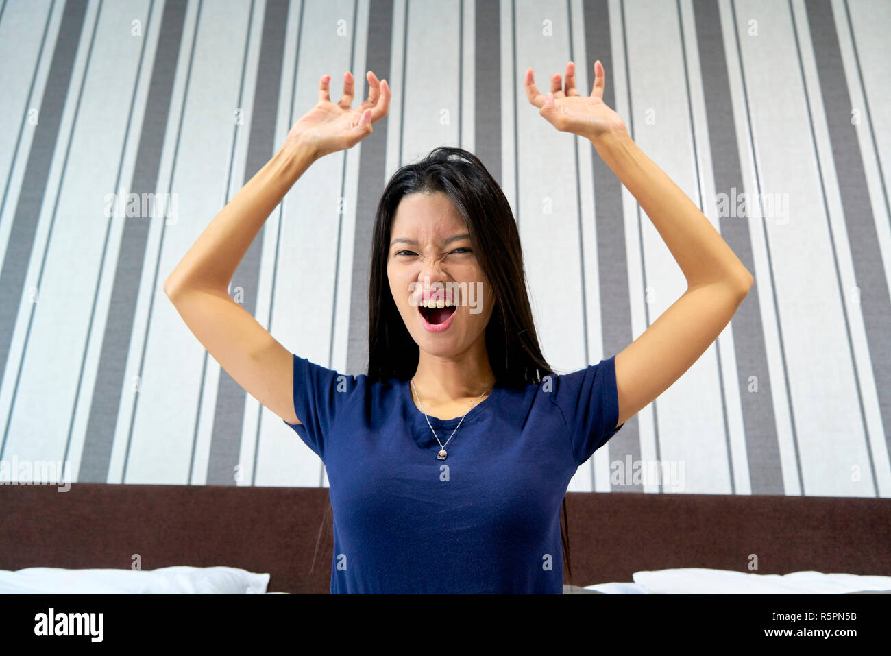 Beautiful women posing - upset, angry woman Stock Photo - Alamy