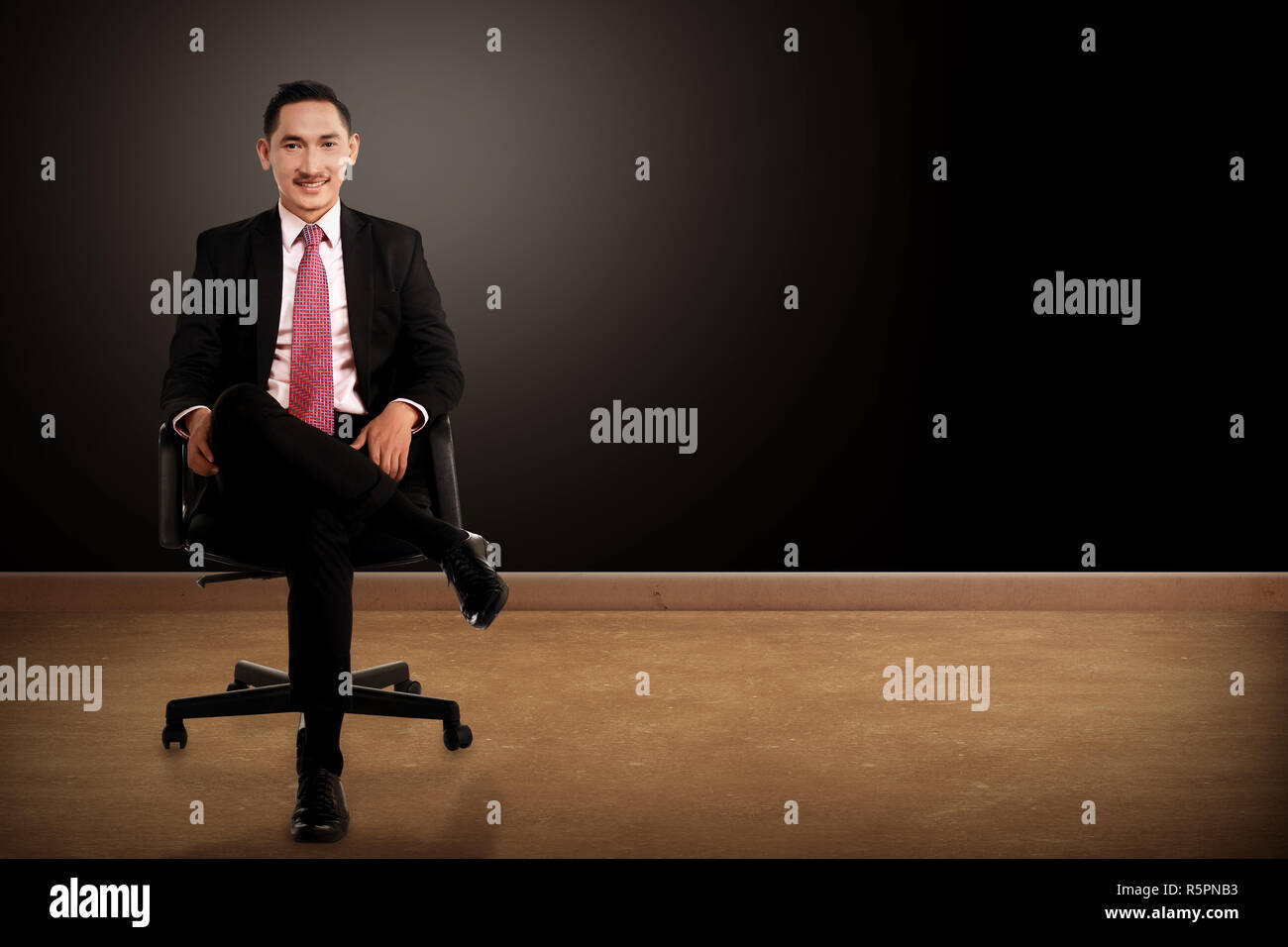 Business man sitting on the chair Stock Photo - Alamy