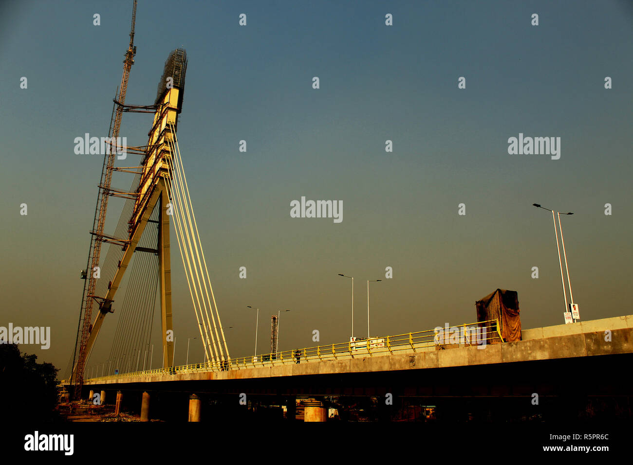 DELHI, INDIA, View of the Signature bridge being constructed across the ...