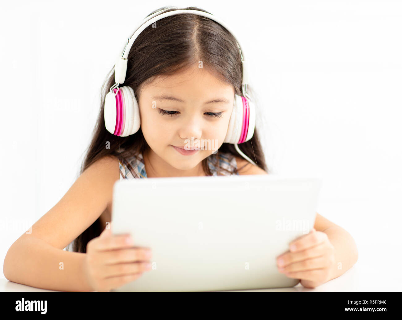 Child tablet headphones hi-res stock photography and images - Alamy