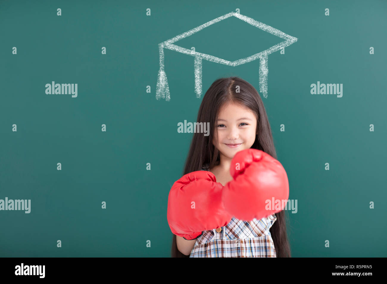 happy girl with boxing gloves and graduation concept Stock Photo - Alamy