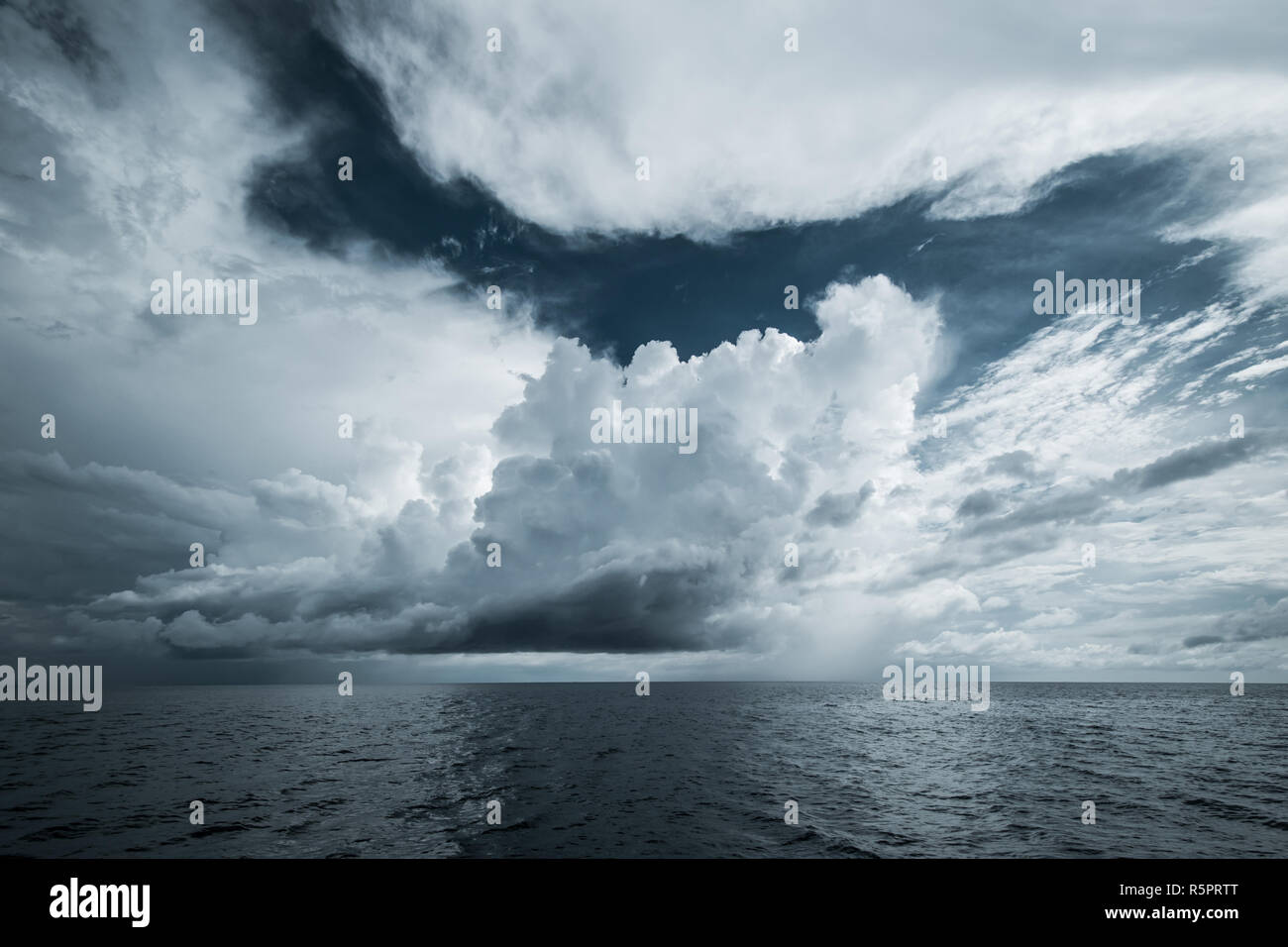 Dark clouds in open ocean Stock Photo - Alamy