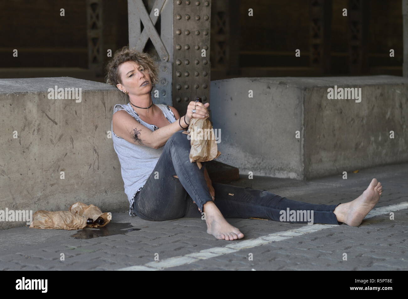 Homeless woman barefoot hi-res stock photography and images - Alamy