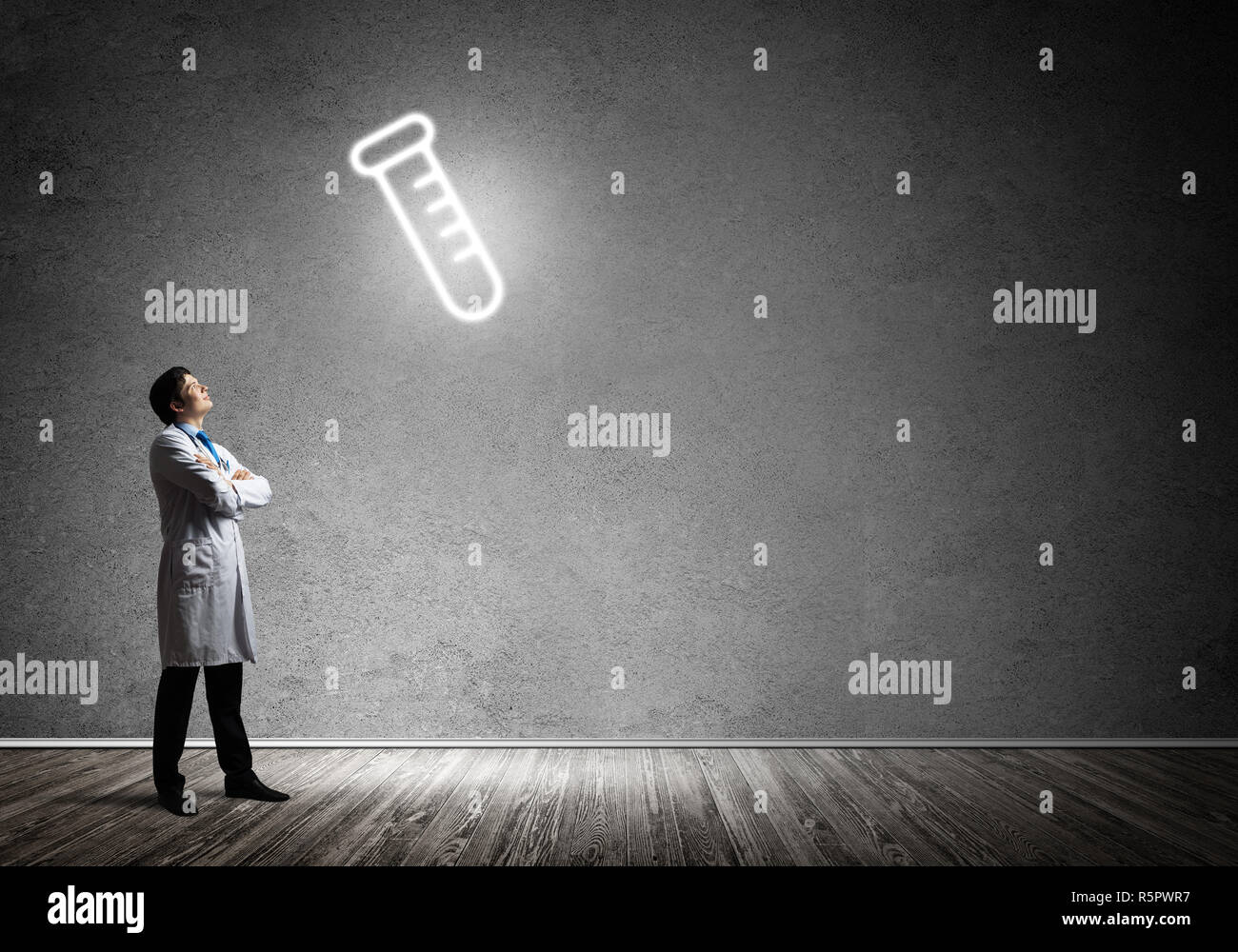 Doctor and vial symbol Stock Photo - Alamy