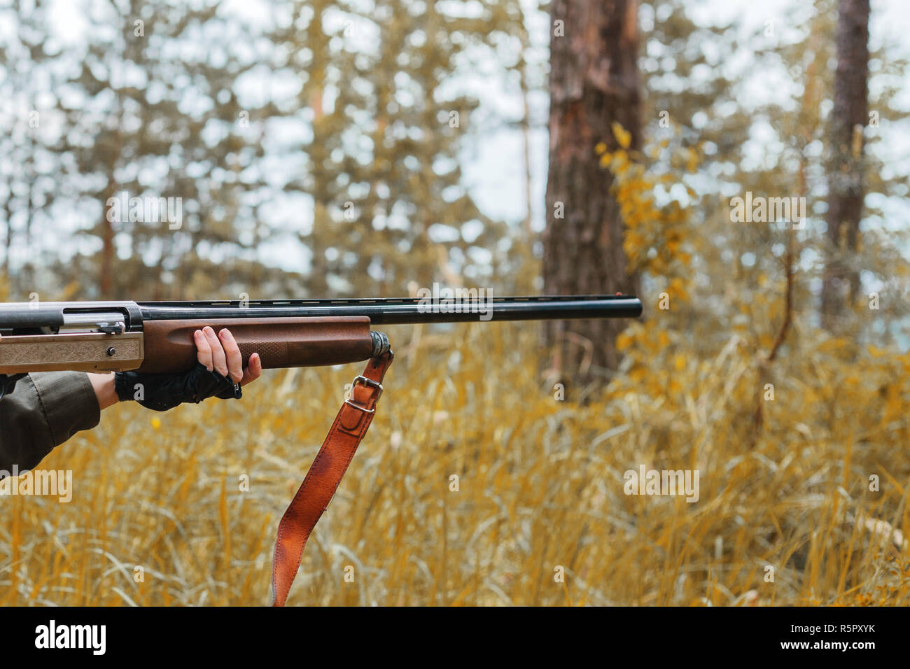 Female woman holding shotgun hi-res stock photography and images - Alamy