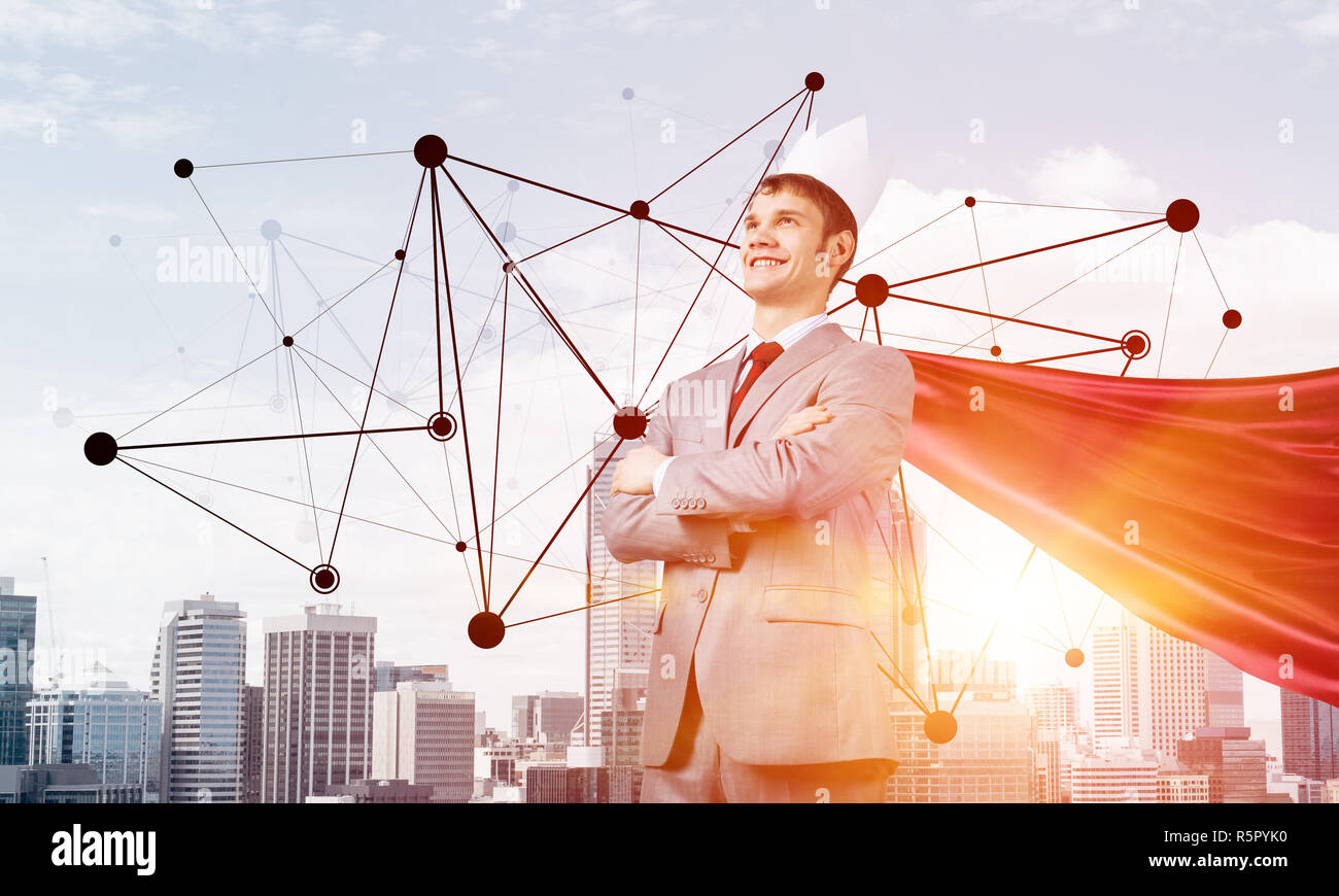 Concept of power and sucess with businessman superhero in big city ...