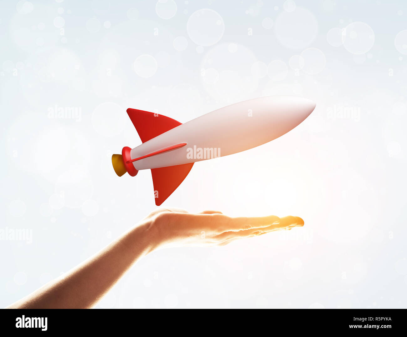 Rocket in hand as symbol for high technologies and science Stock Photo ...
