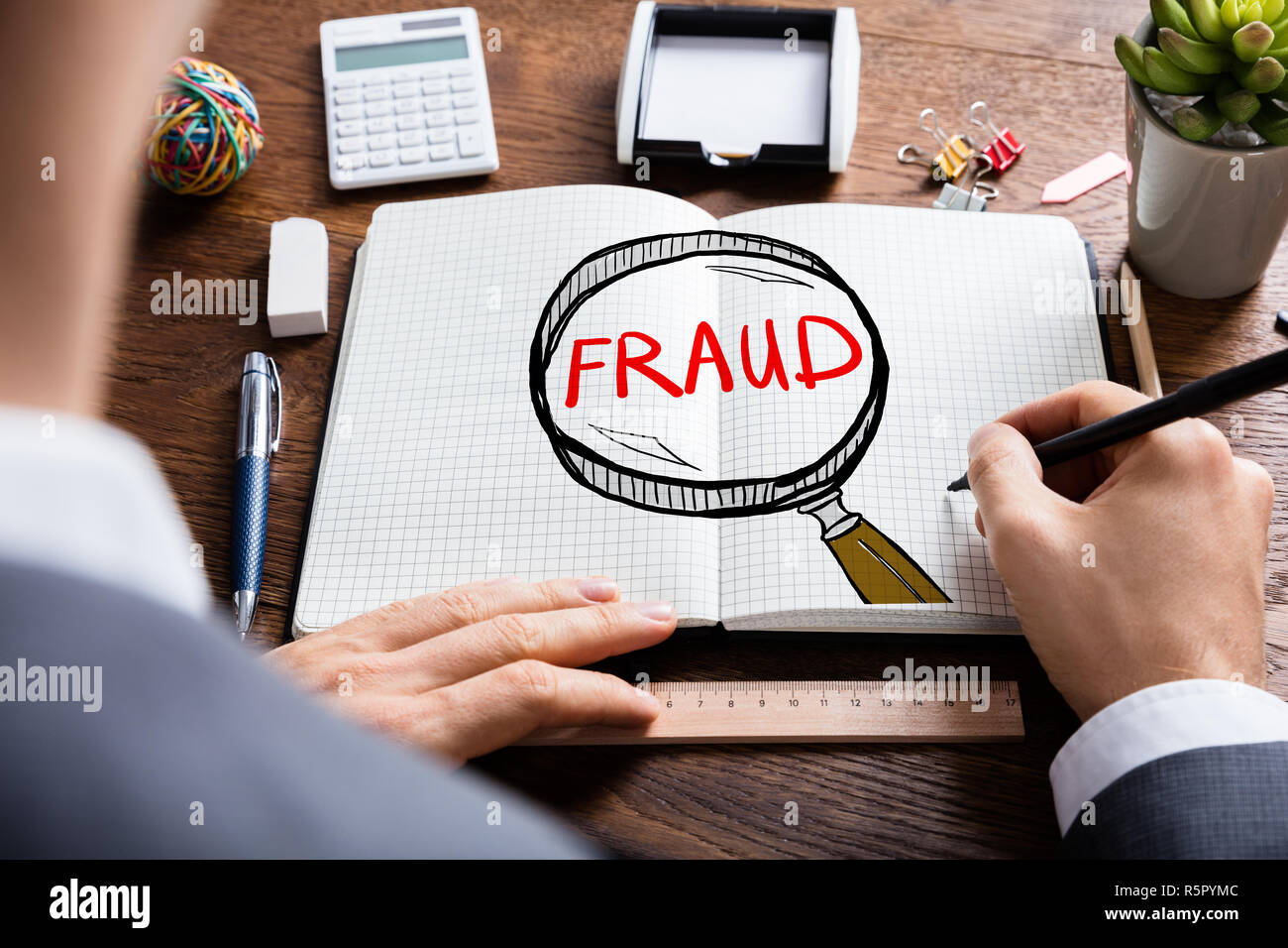 Man Drawing Fraud Investigation And Audit Stock Photo - Alamy