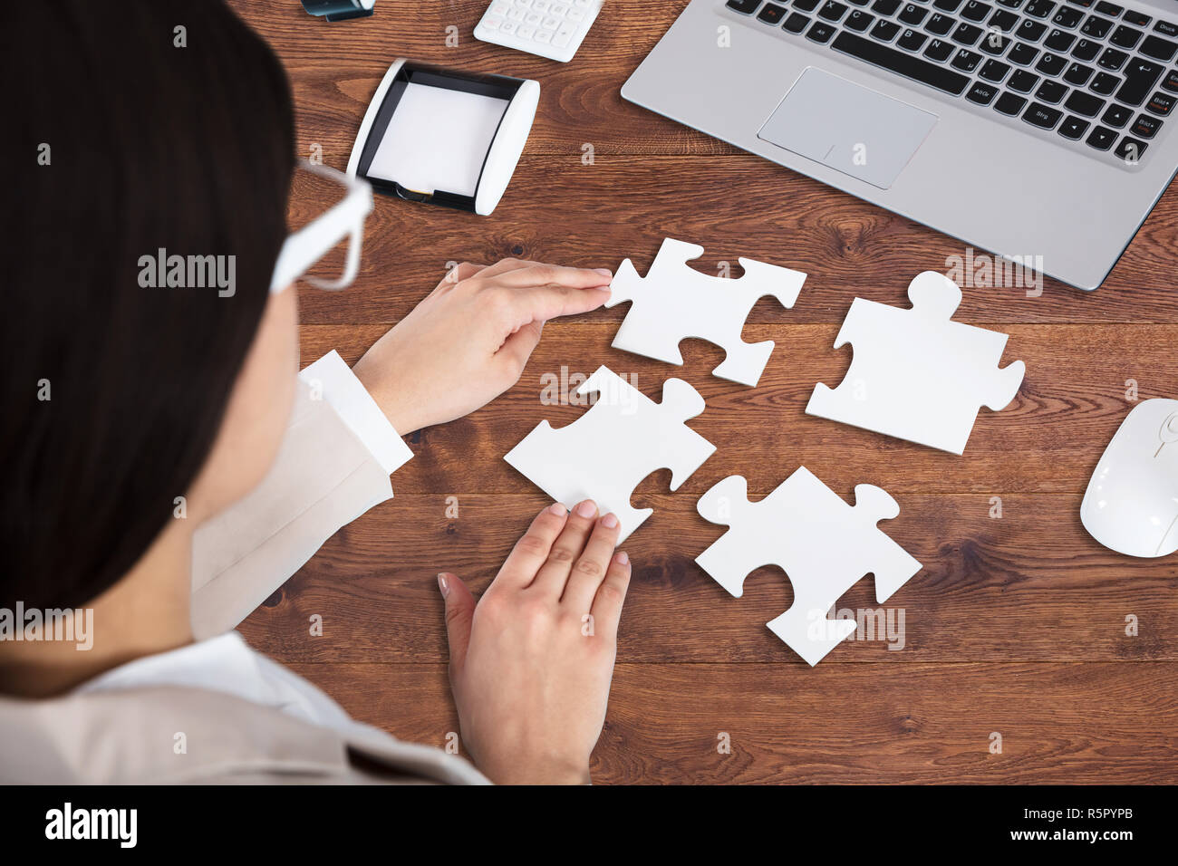 Woman hand placing jigsaw puzzle hi-res stock photography and images ...