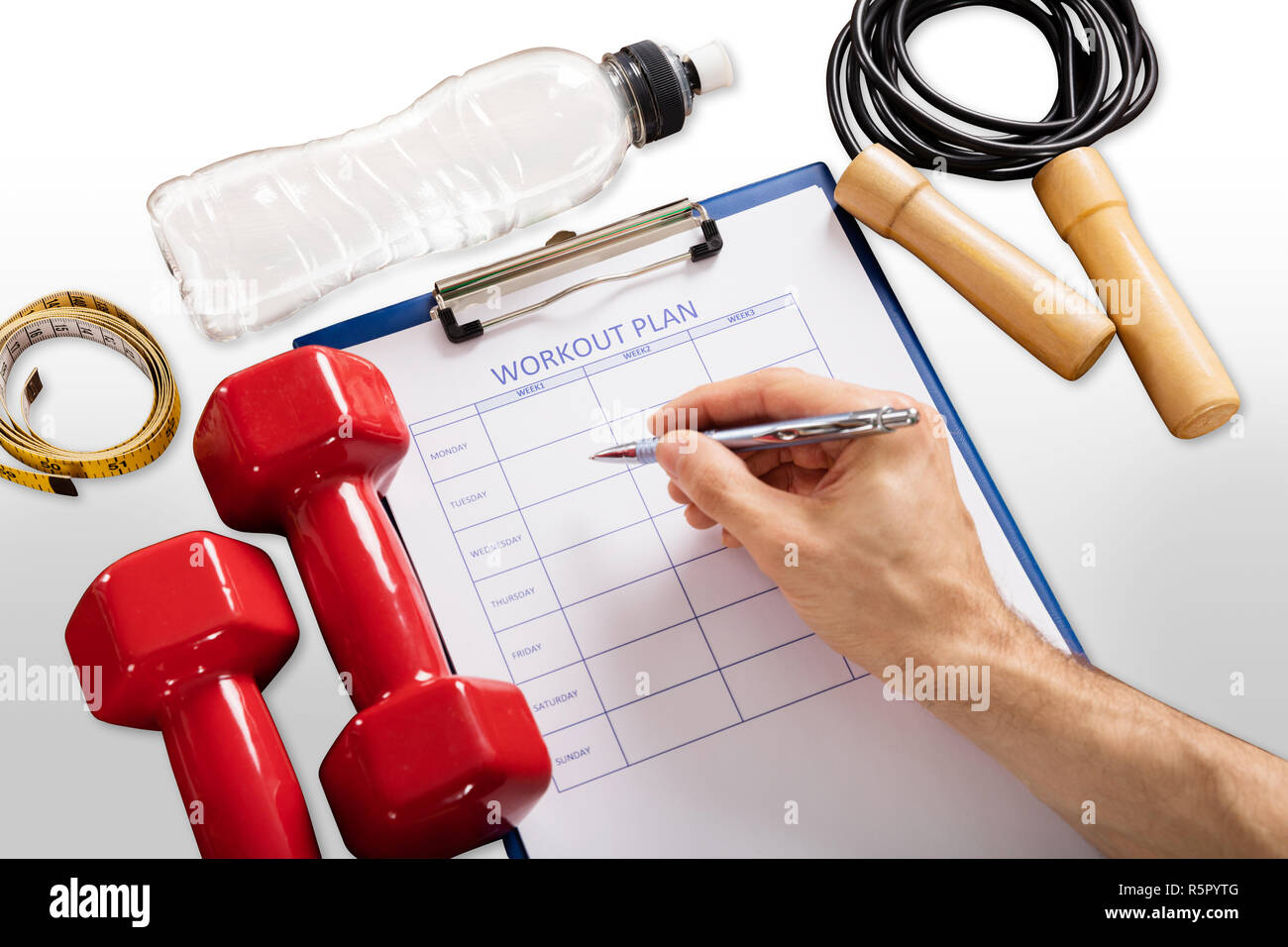 Person's Hand Filling Workout Plan Form Stock Photo - Alamy