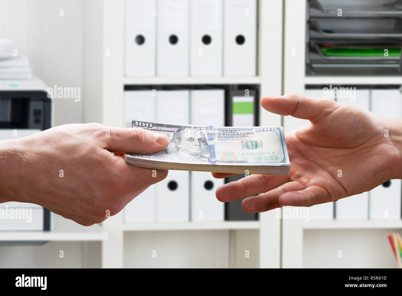 Two People Hands With Money Stock Photo - Alamy