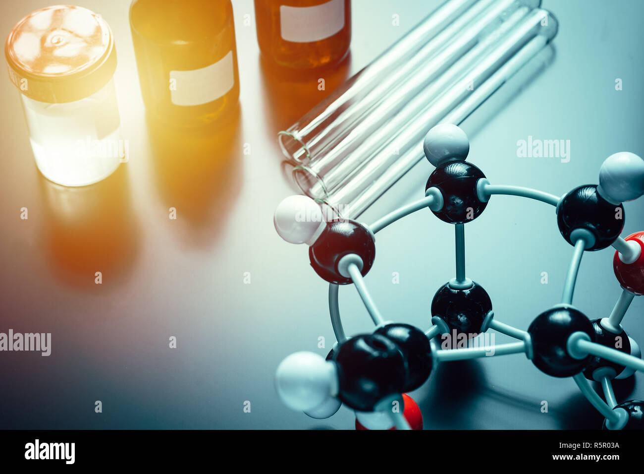 molecular formula and laboratory equipment on blue background. Science ...