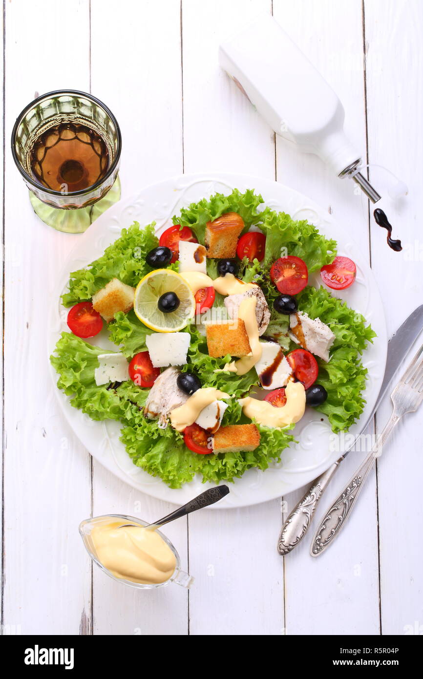 Caesar salad with chicken and red wine Stock Photo - Alamy