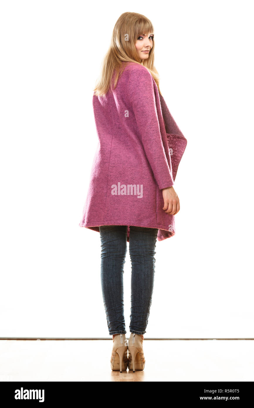 Fashion. Young blonde fashionable woman in vivid color pink coat ...