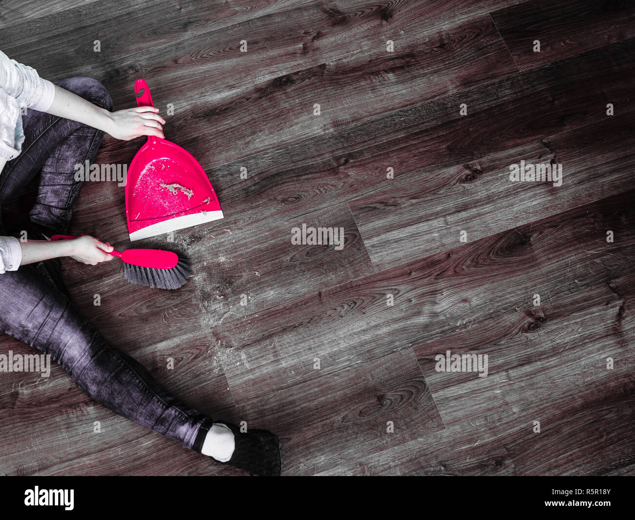 Cleanup housework concept. Closeup cleaning woman sweeping wooden floor ...