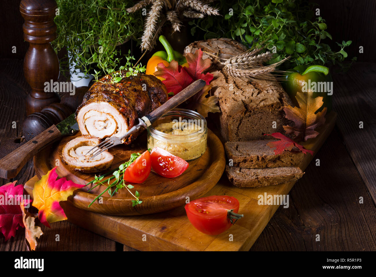 rolling roast fullly with dried fruit and bacon Stock Photo - Alamy