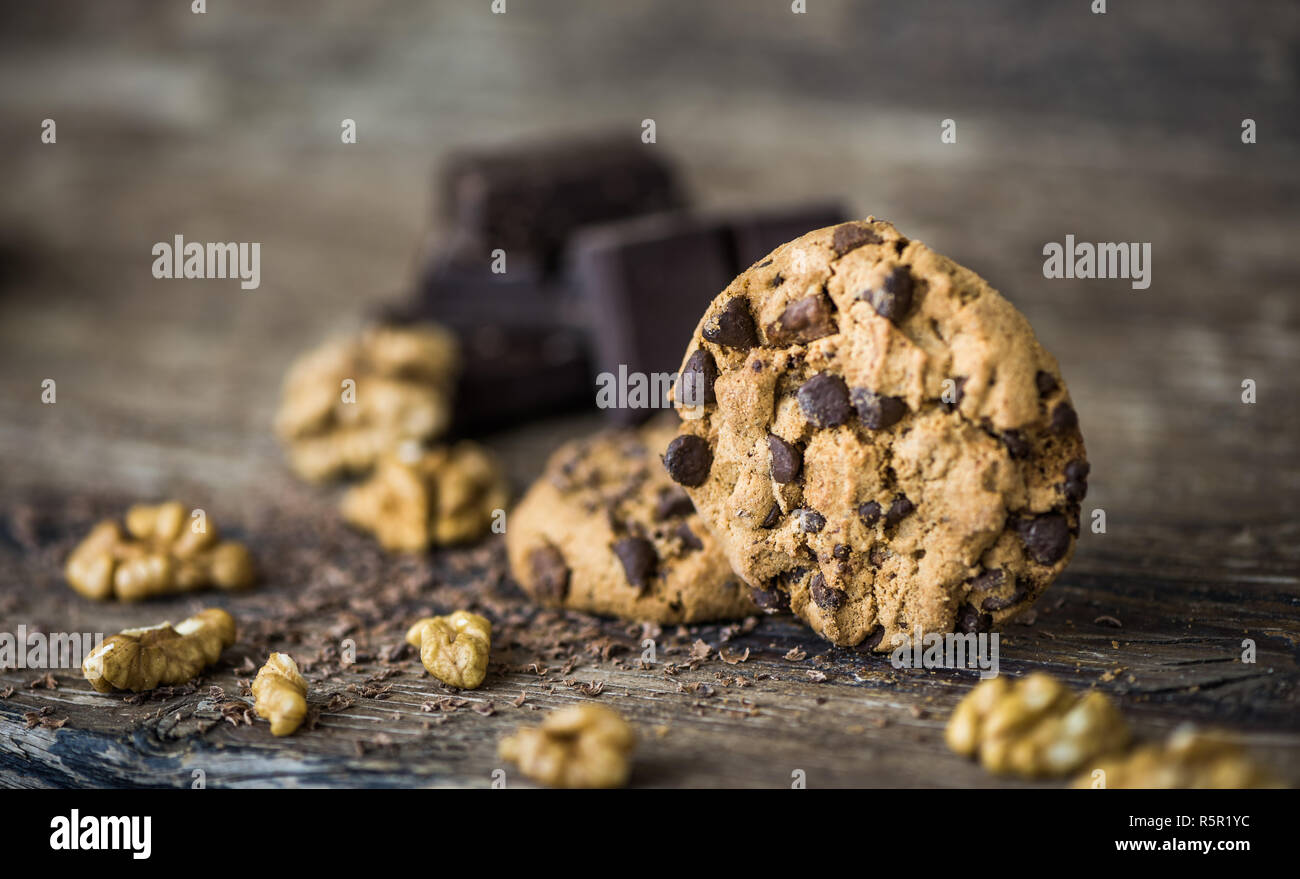 Chocolate Chip Cookies and Walnuts on Wooden Rustic Background Stock ...