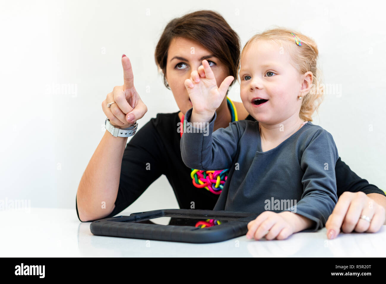 Toddler girl in child occupational therapy session doing sensory ...