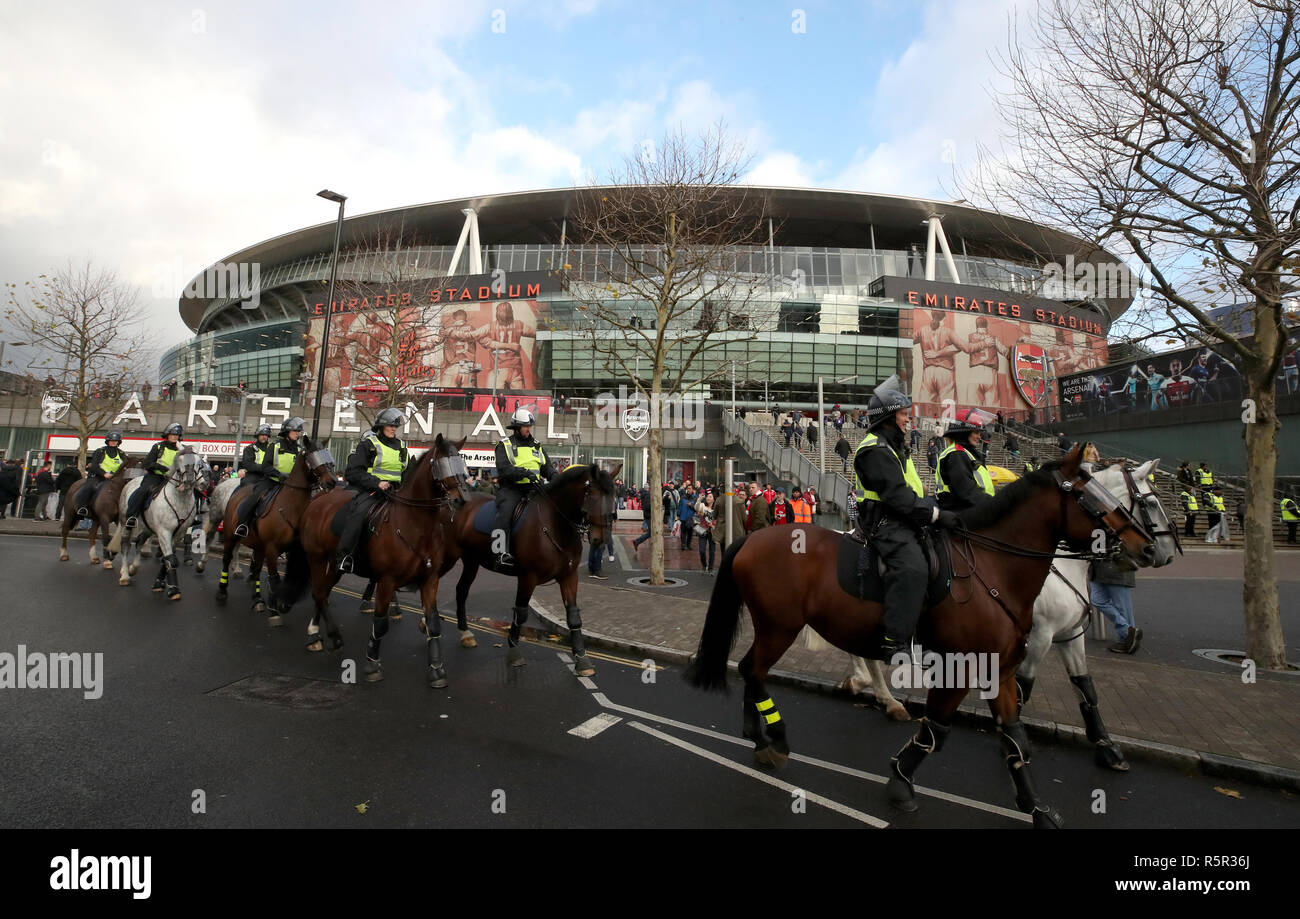 Police on patrol outside at Emirates Stadium, London Stock Photo - Alamy