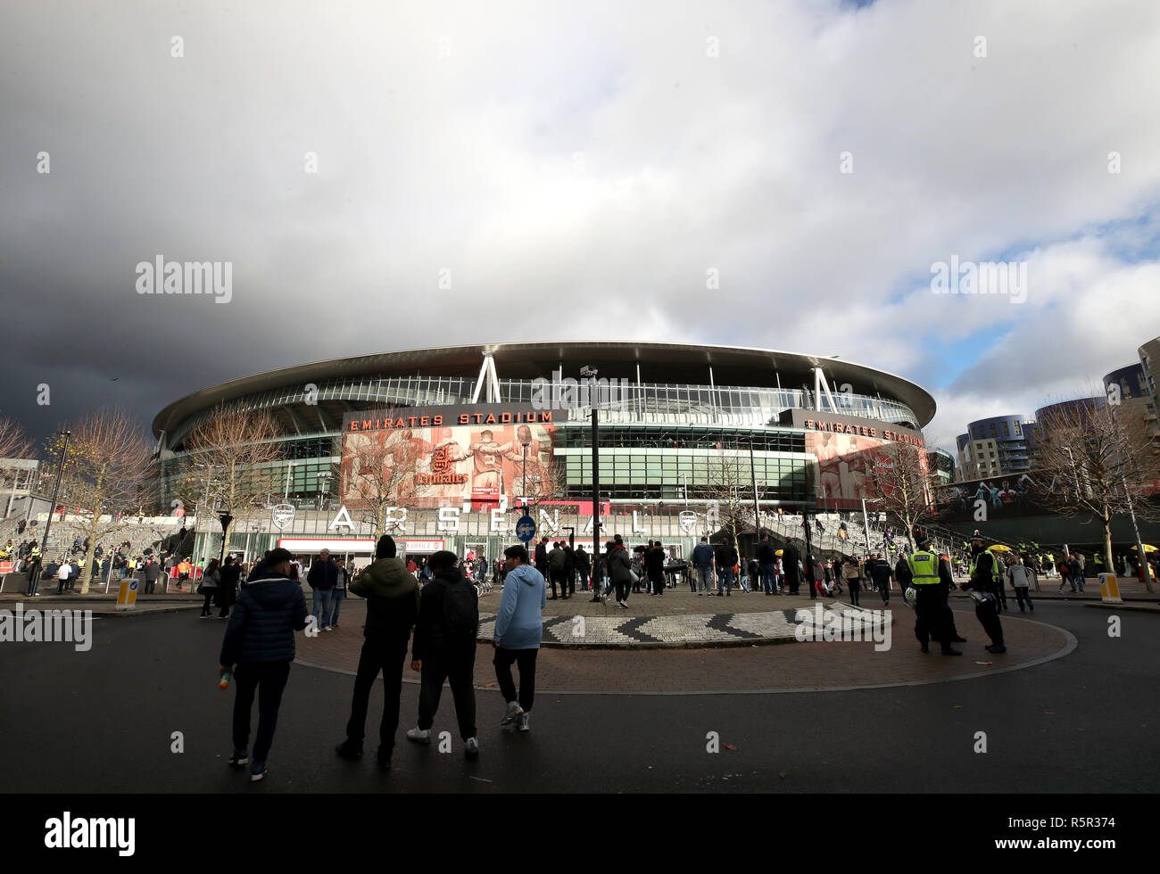 Fans arrive at Emirates Stadium, London Stock Photo - Alamy