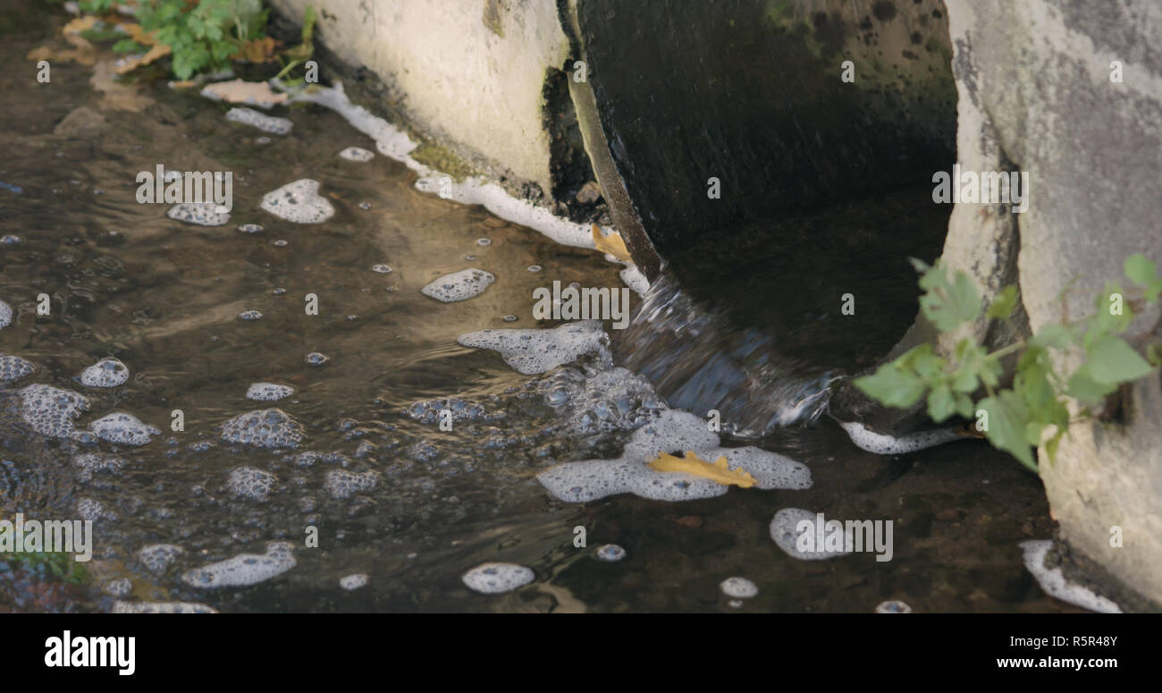 small stream of water flowing from pipe Stock Photo - Alamy
