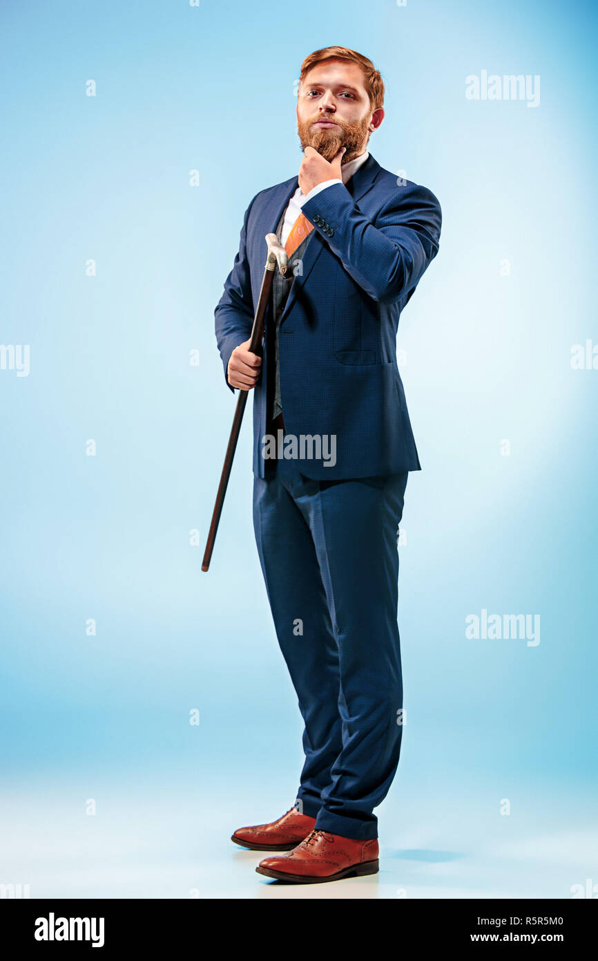 The barded man in a suit holding cane Stock Photo - Alamy