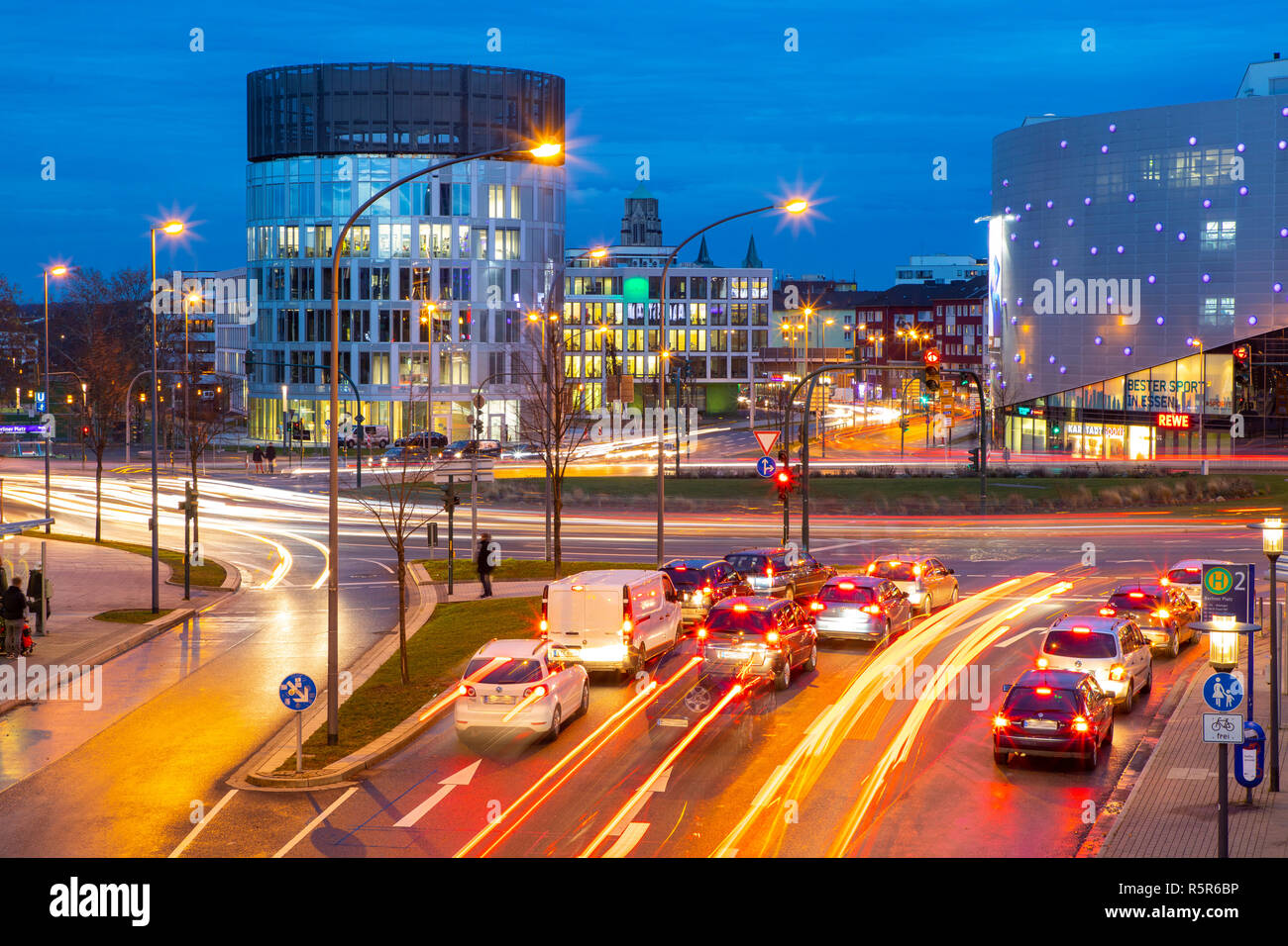 Evening city traffic in Essen, Germany, large intersection, roundabout ...