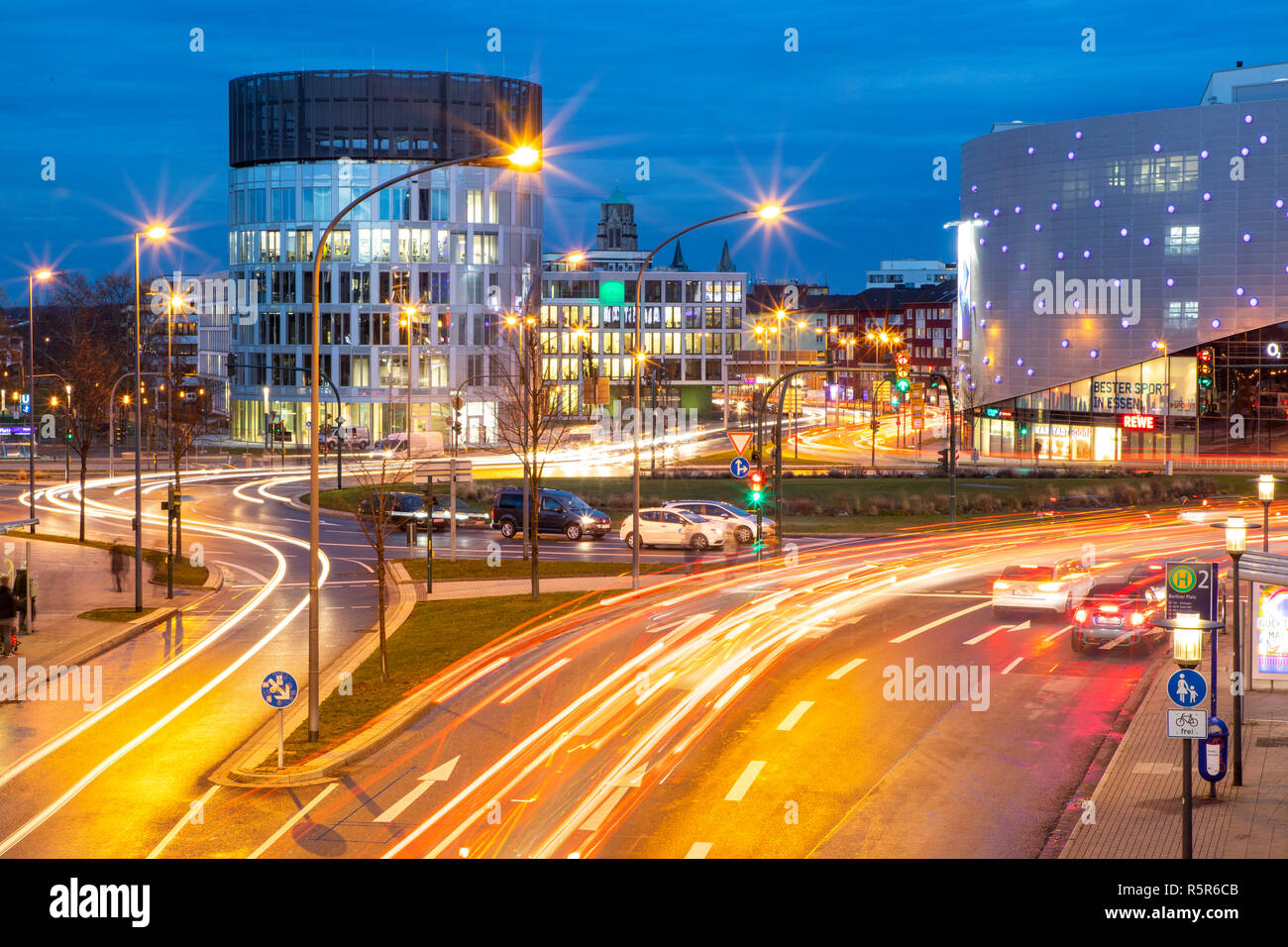 Evening city traffic in Essen, Germany, large intersection, roundabout ...