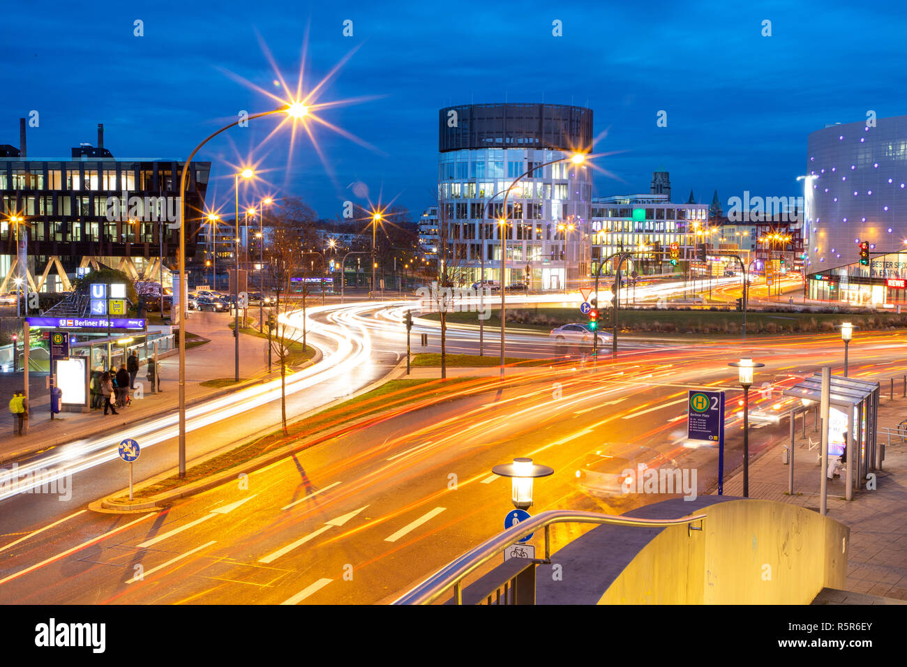 Evening city traffic in Essen, Germany, large intersection, roundabout ...