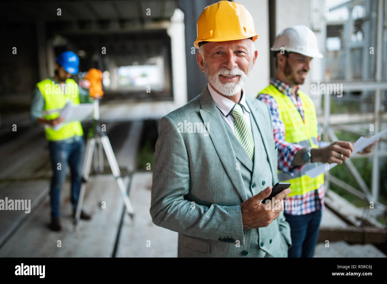 Group of construction engineer working in construction site Stock Photo ...