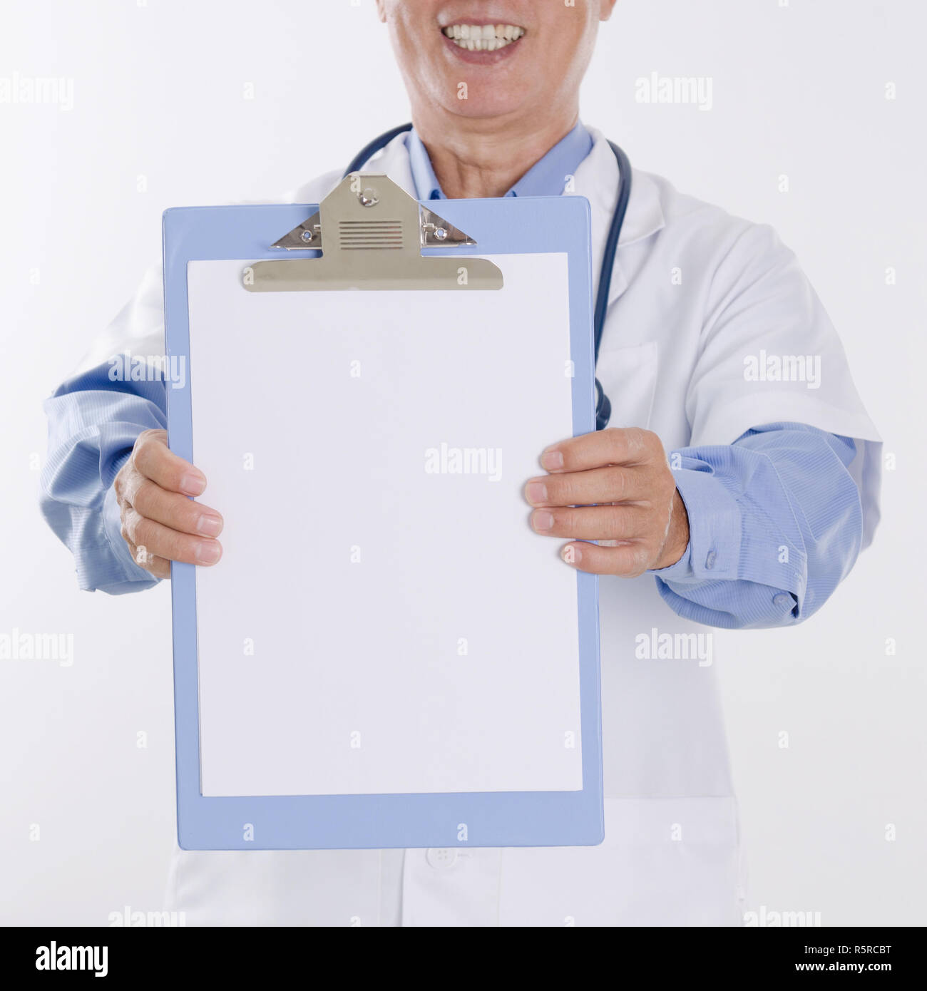 Medical doctor holding health report Stock Photo - Alamy