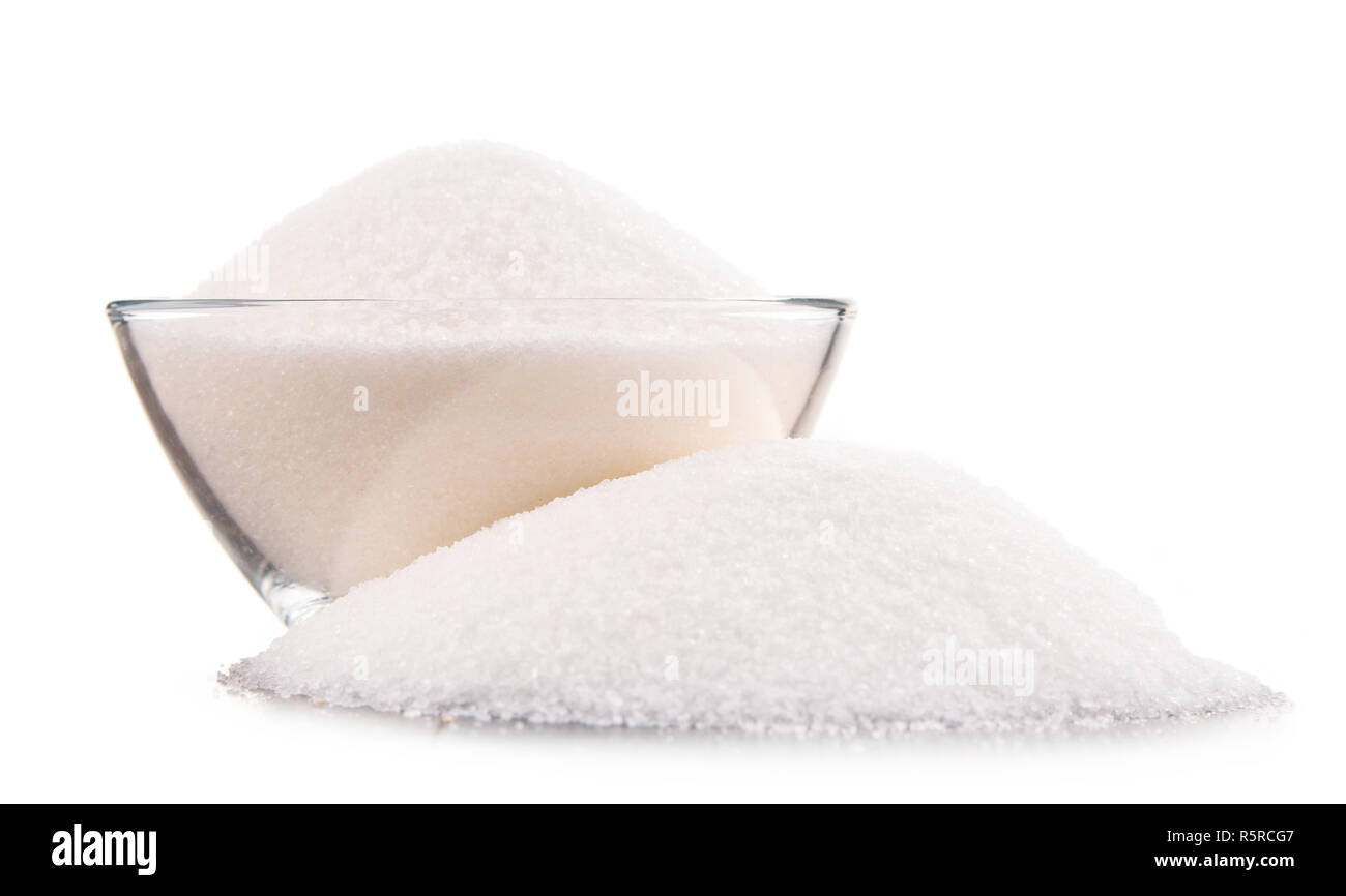 Bowl of white refined sugar on white background Stock Photo - Alamy