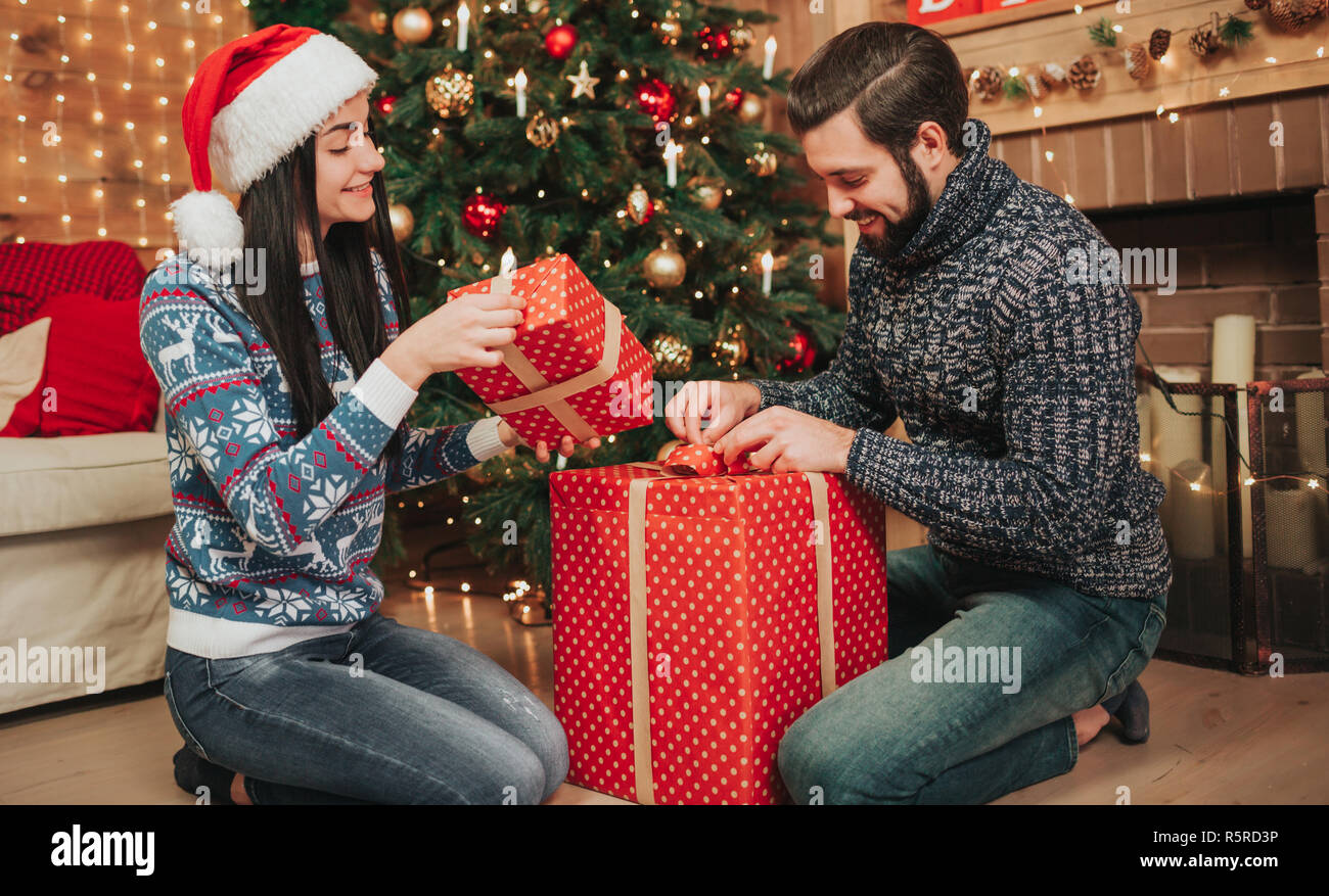Merry Christmas and Happy New Year . Young couple celebrating holiday ...