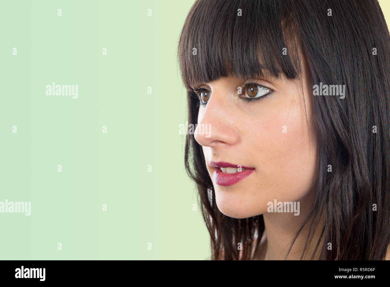 portrait of beautiful brunette girl, side view Stock Photo - Alamy