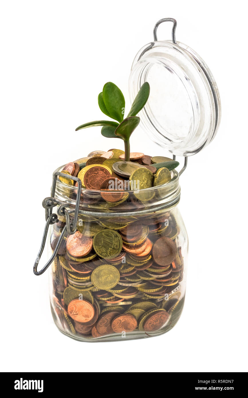 saving coins in a jar - concept Stock Photo - Alamy